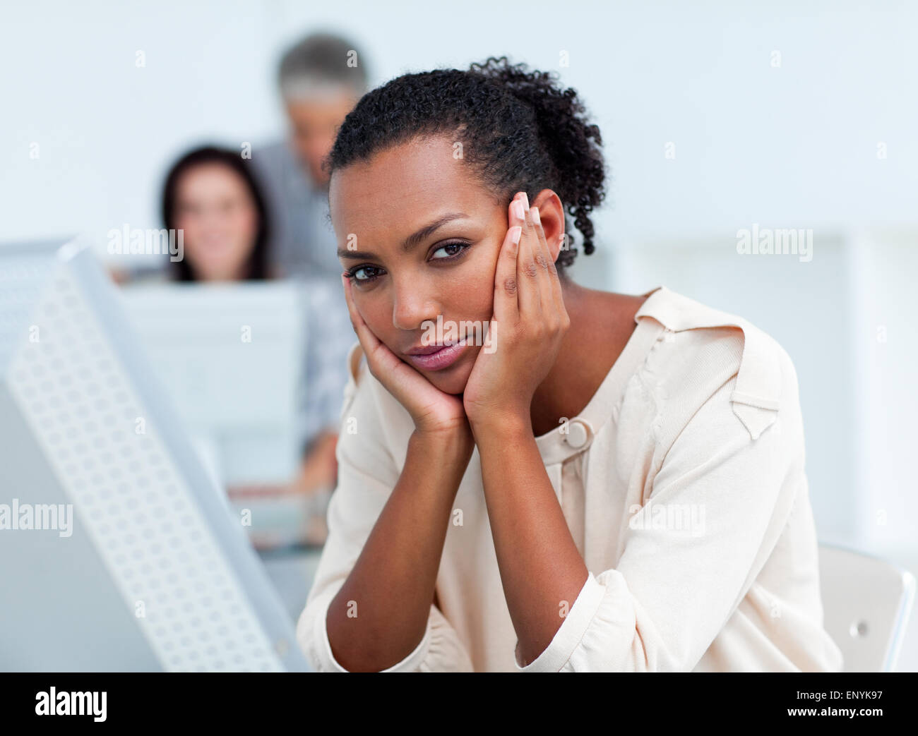 Bored young businesswoman at her desk Stock Photo - Alamy