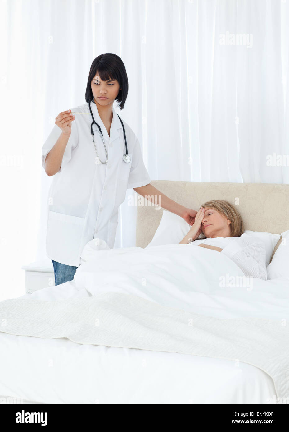 Nurse taking female patient temperature hi-res stock photography and ...