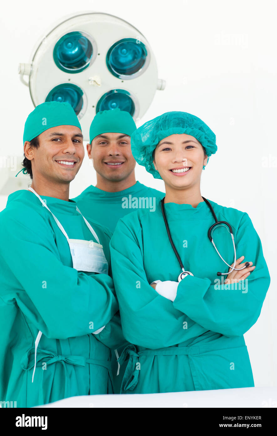 Smiling team of surgeon Stock Photo - Alamy