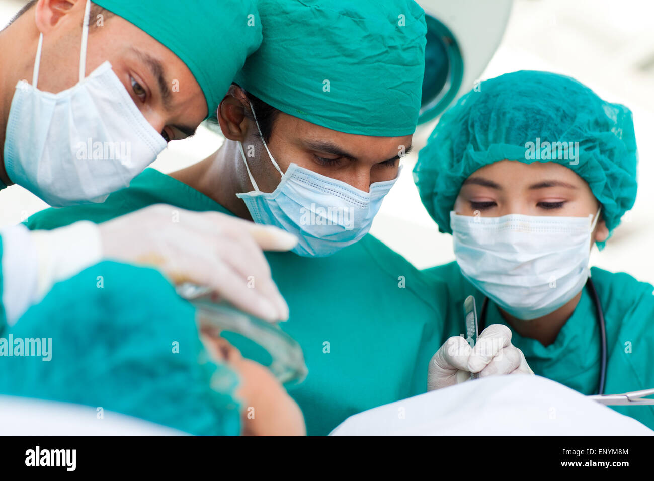 Serious surgeons during a surgery Stock Photo - Alamy