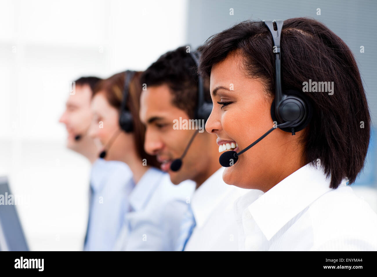 Customer service agents with headset on Stock Photo - Alamy