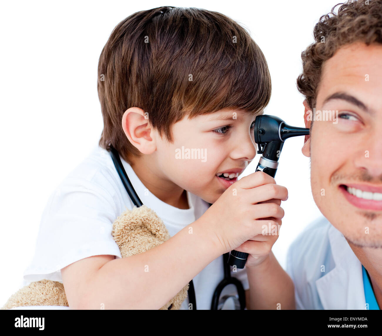 Cute child checking doctor's ears at the hospital Stock Photo - Alamy