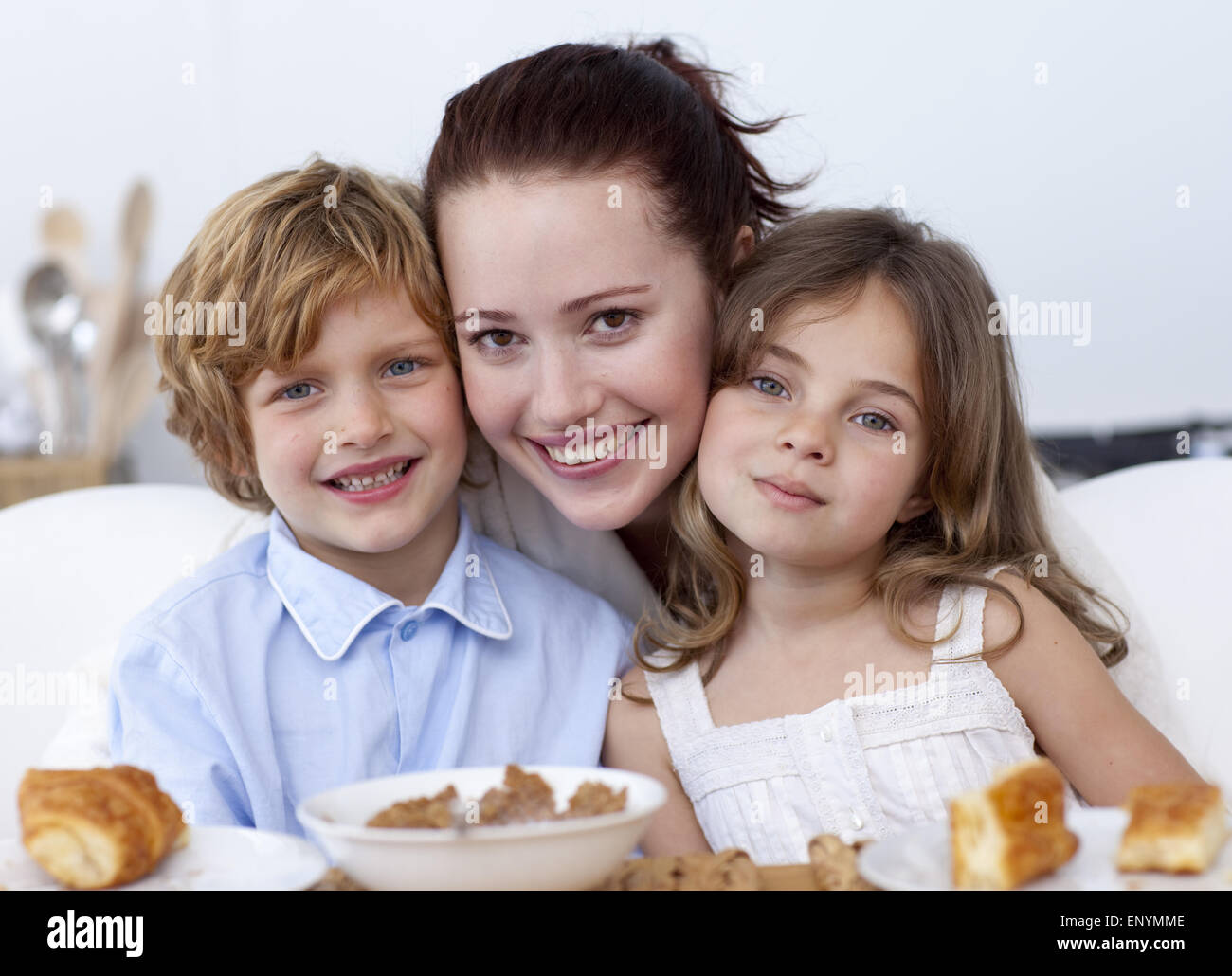 Children having breakfast with their mother Stock Photo - Alamy