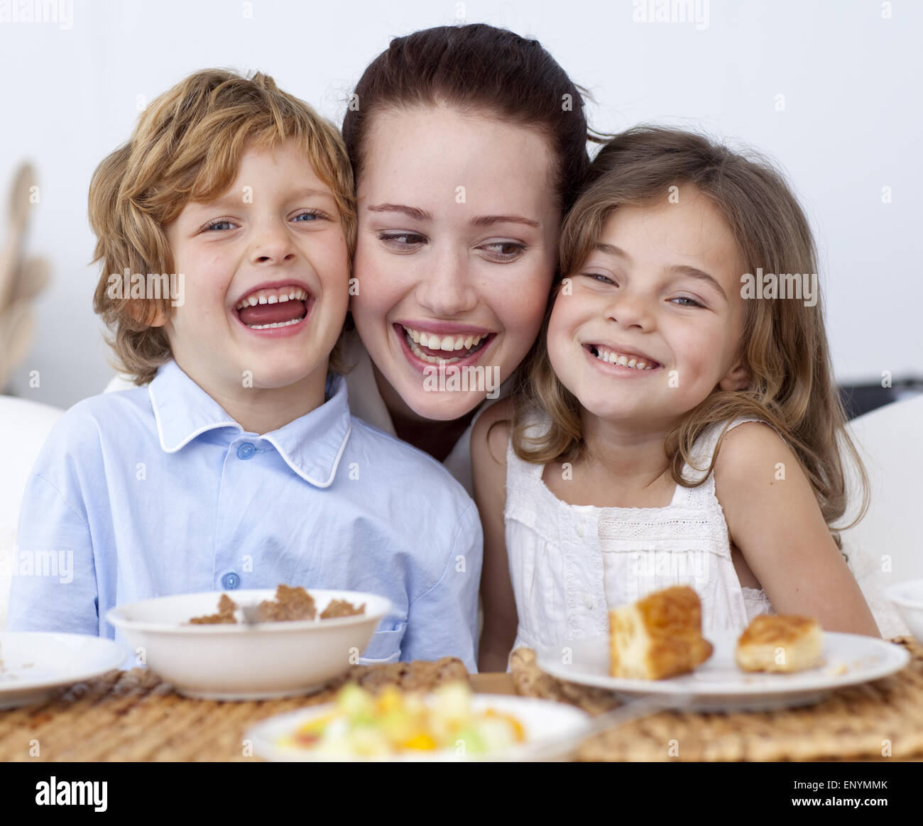Children having breakfast with their mother Stock Photo - Alamy