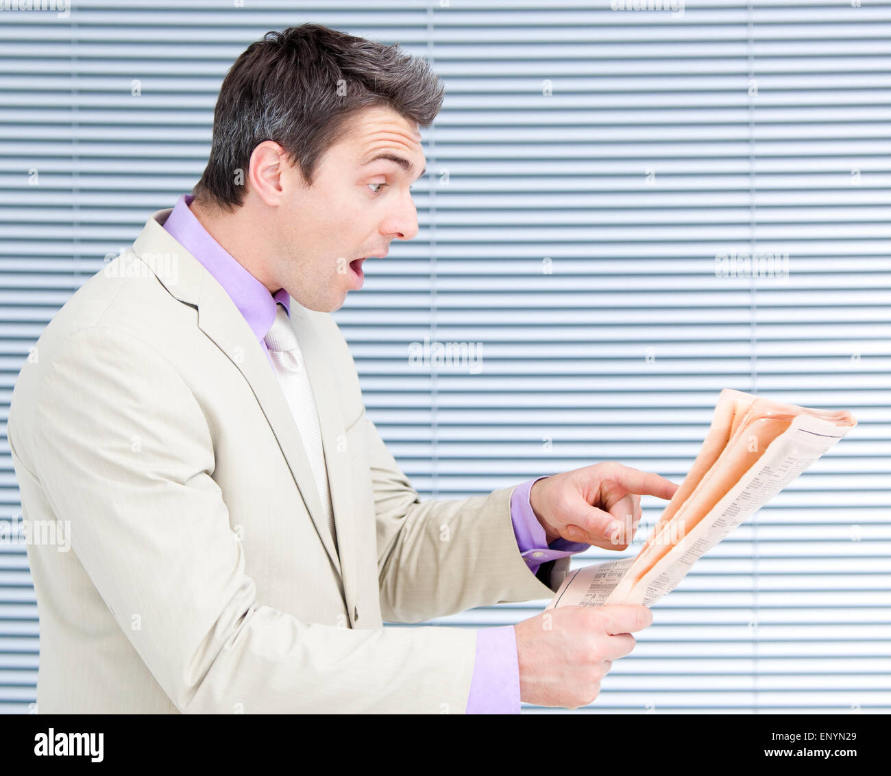 Business man reading tabloid newspaper hi-res stock photography and ...