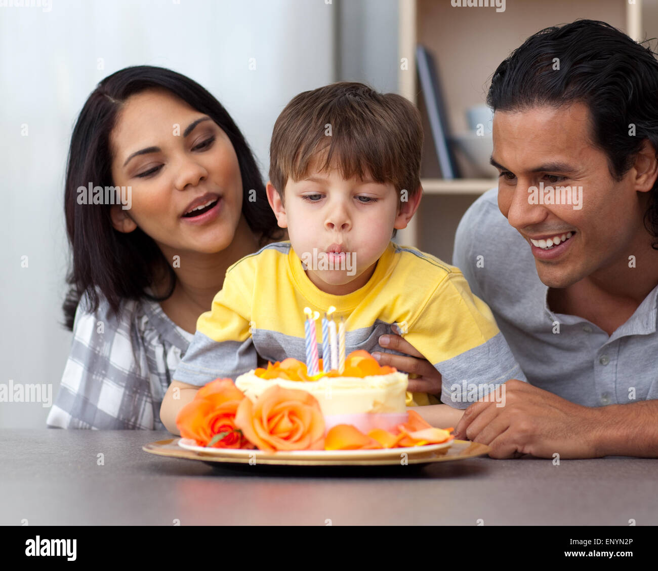 Young parents celebrating their son's birthday Stock Photo - Alamy