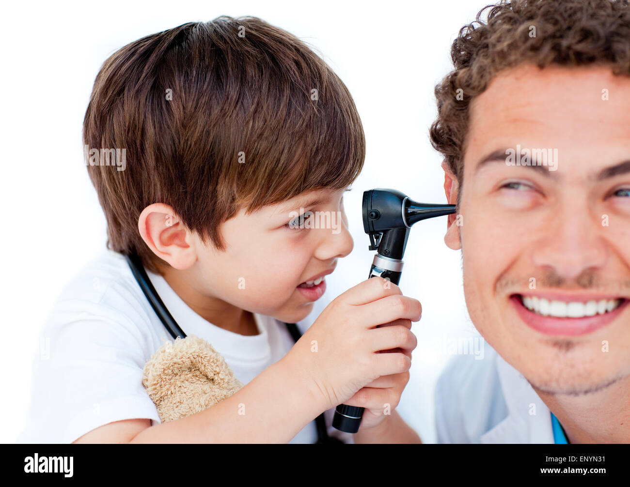 Cute little boy playing with his doctor Stock Photo - Alamy