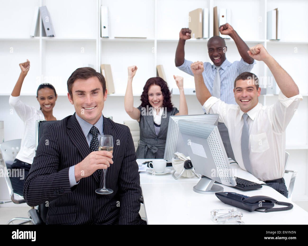 Happy team celebrating work toast hi-res stock photography and images ...