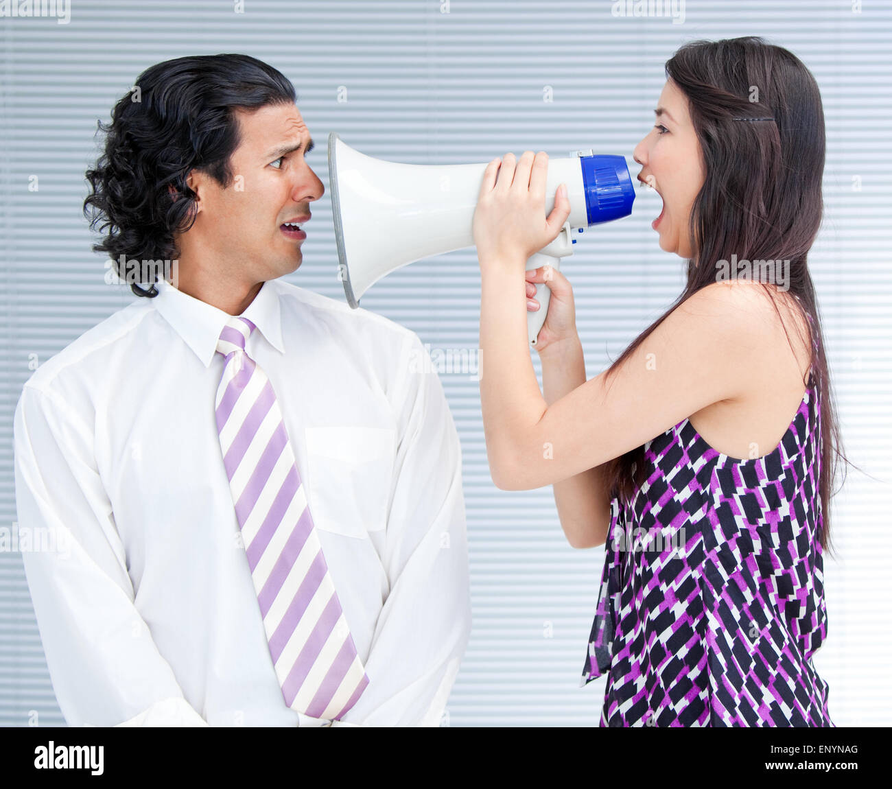 Furious businesswoman yelling through a megaphone Stock Photo - Alamy