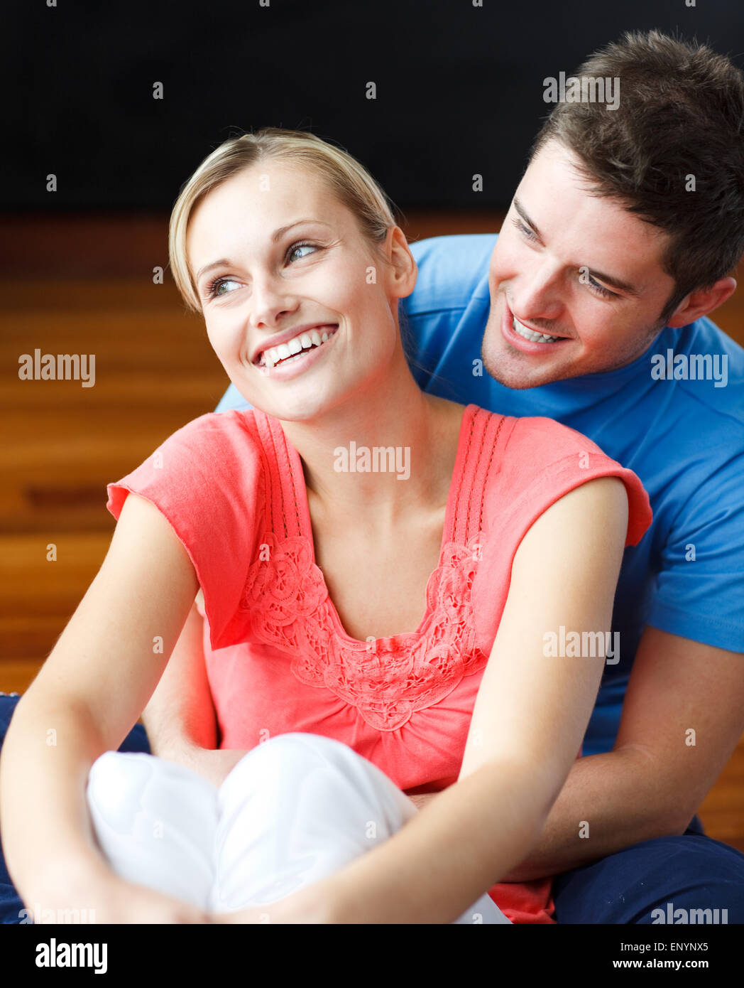 Lovers sitting in their new house Stock Photo - Alamy