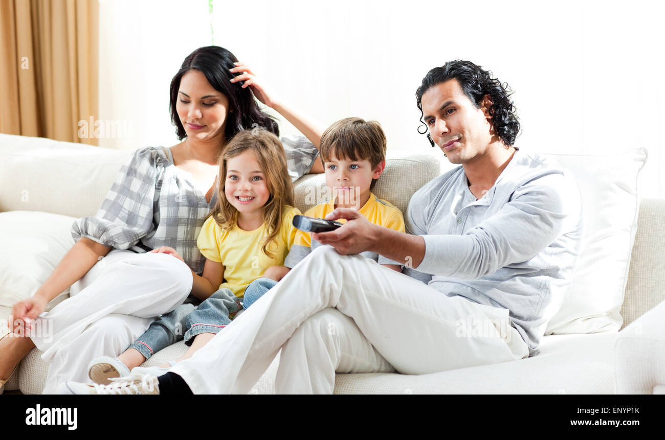Smiling family watching TV Stock Photo - Alamy