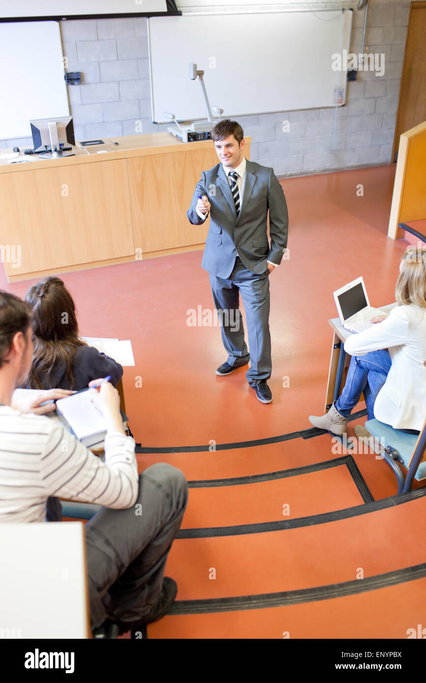 Happy teacher students writing hi-res stock photography and images - Alamy