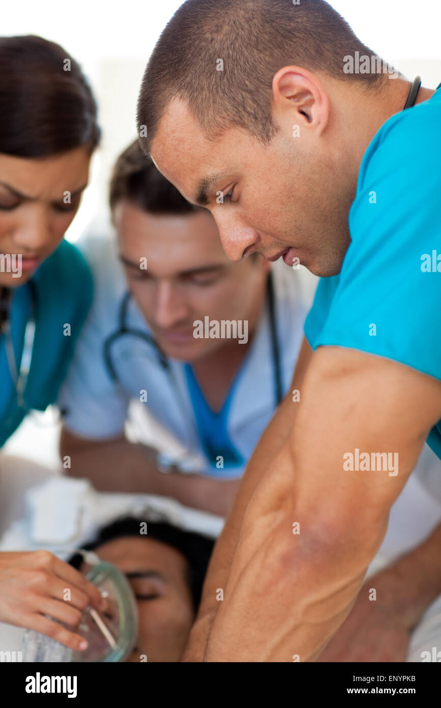 Doctors performing CPR on a patient Stock Photo - Alamy