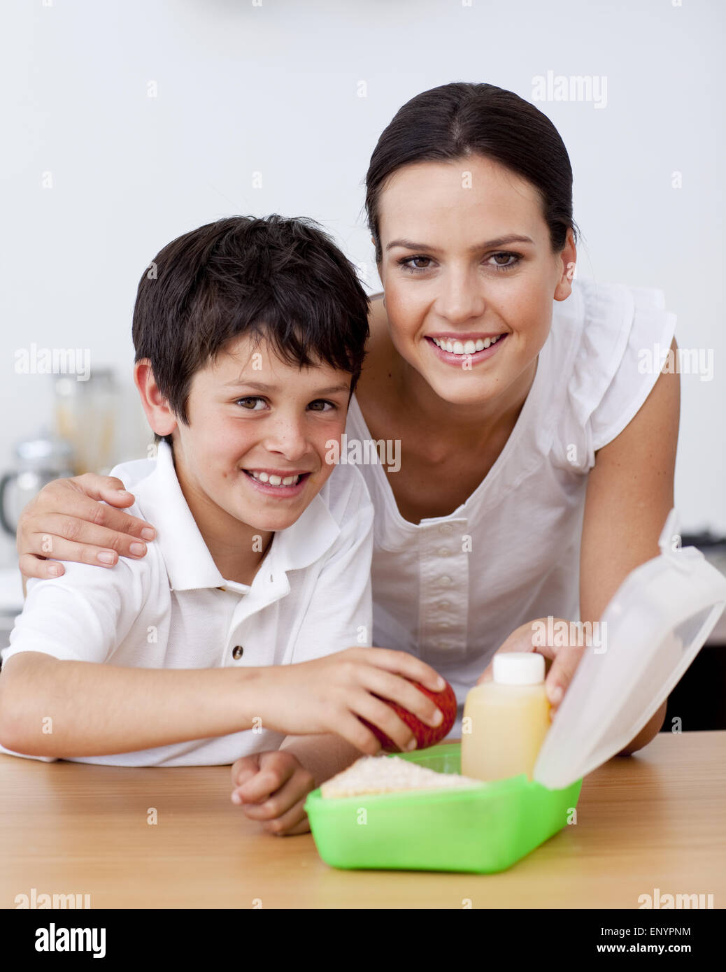 Smiling mother and son making the school lunch Stock Photo - Alamy