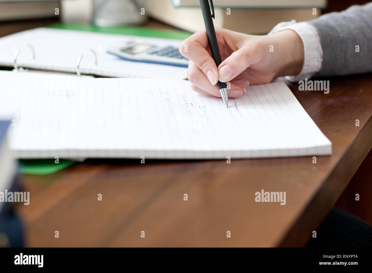Close-up of a female student doing her homework Stock Photo - Alamy