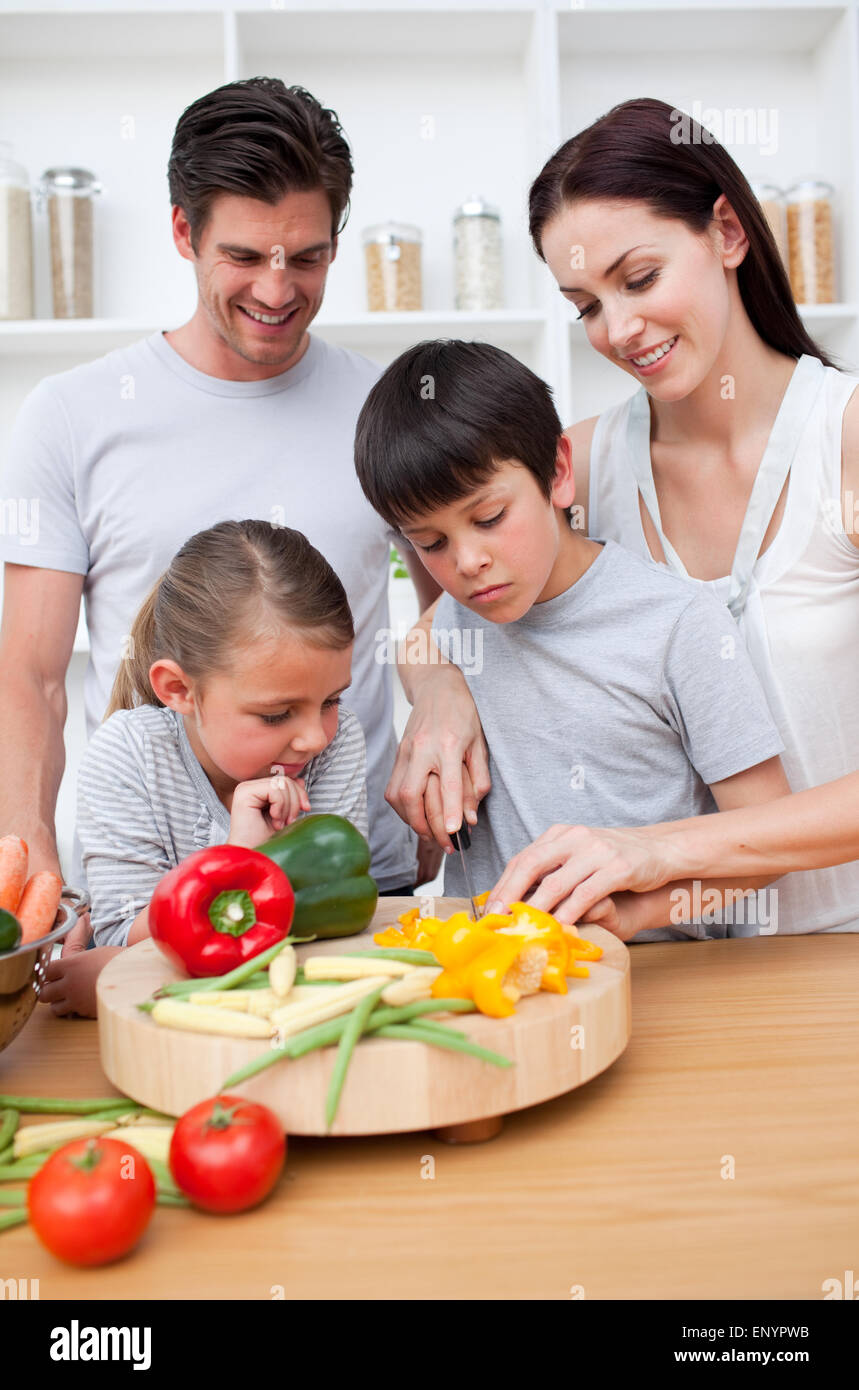 Happy parents and children cooking Stock Photo - Alamy