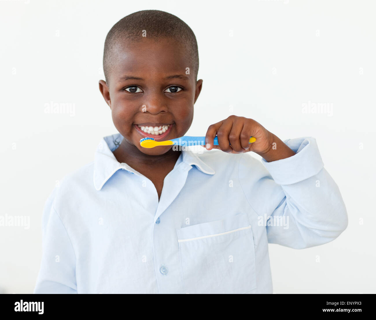 Portrait of a smiling little boy brushing his teeth Stock Photo - Alamy