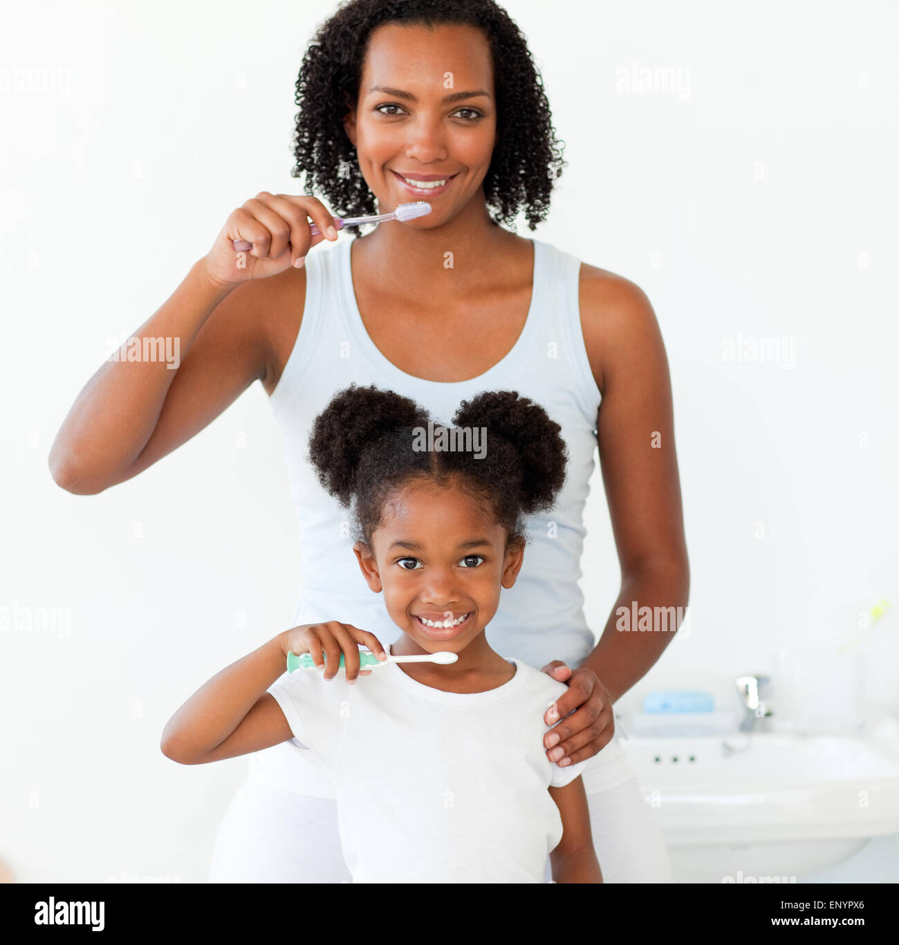 Mother and her daughter brushing their teeth Stock Photo - Alamy