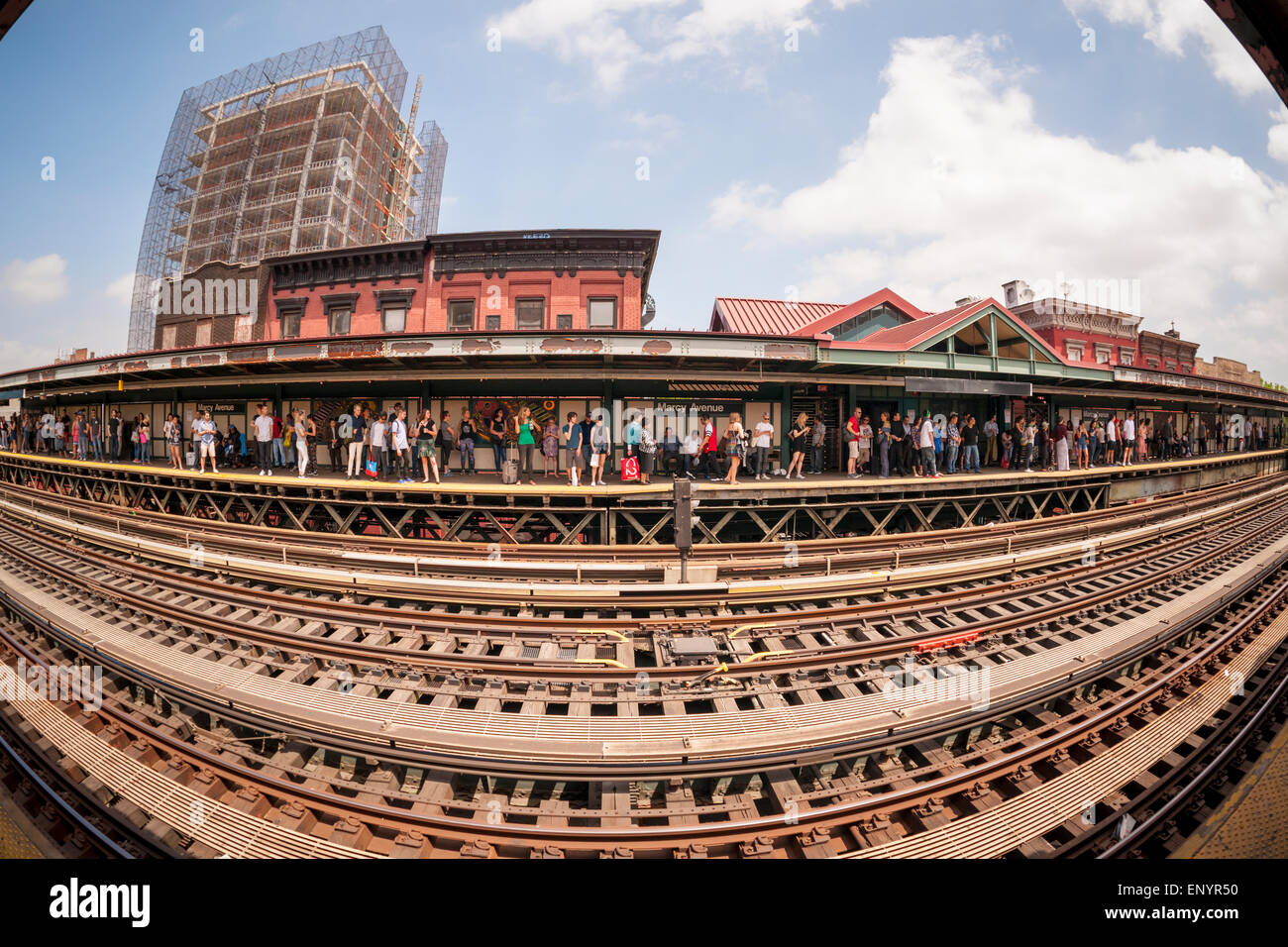 Passengers crowd the subway platform of the Marcy Avenue station, the "J" and "M" lines, in ...