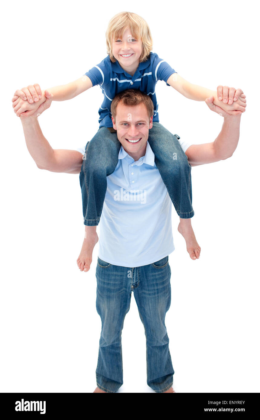 Smiling father giving his son piggyback ride Stock Photo - Alamy