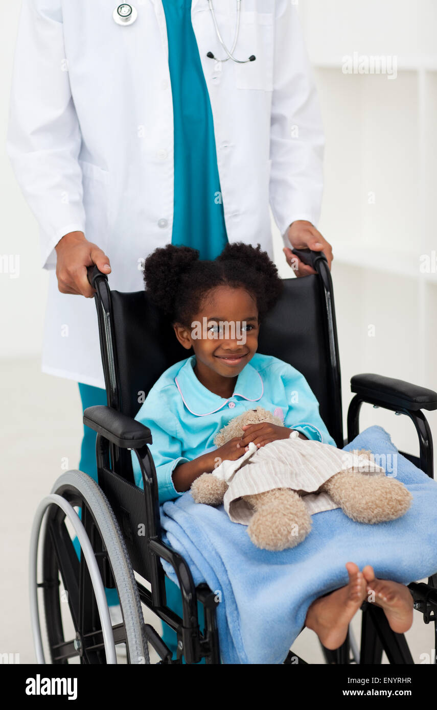 Doctor helping a sick child Stock Photo - Alamy