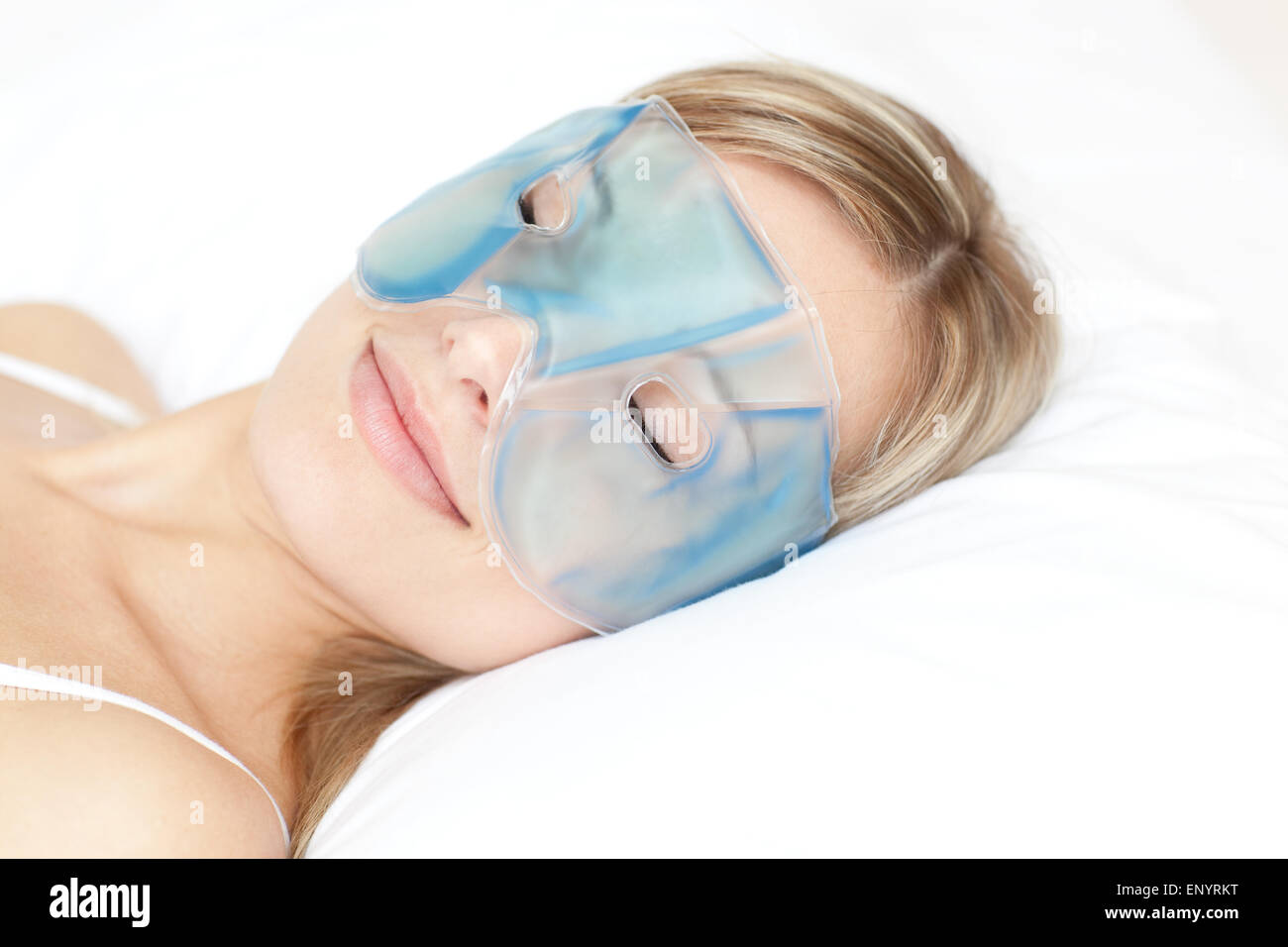 Beautiful woman with an eye gel mask Stock Photo - Alamy