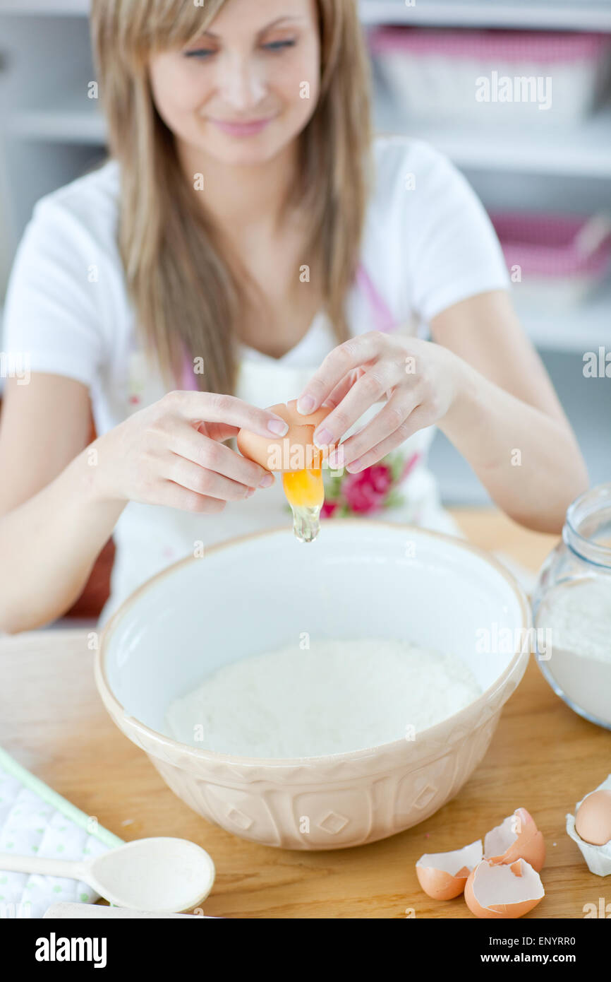 Attractive woman preparing a cake in the kitchen Stock Photo - Alamy