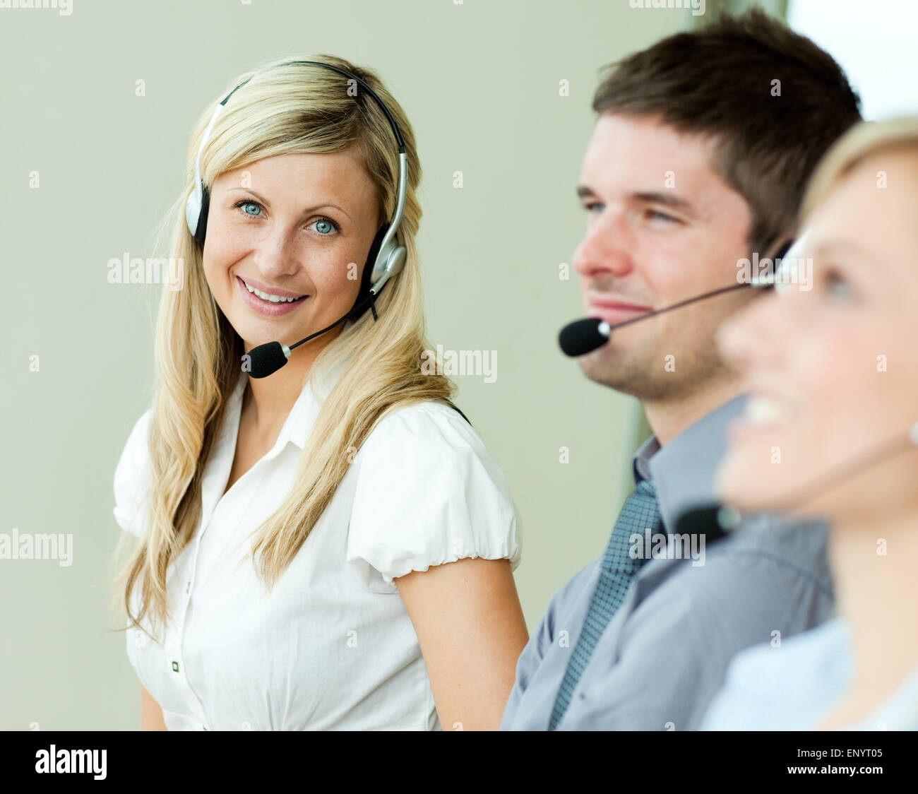 Businesspeople working with headsets Stock Photo - Alamy