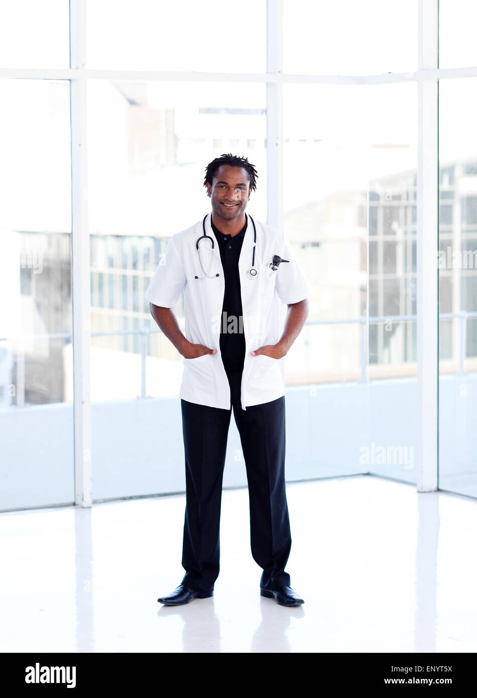 Afro-American smiling doctor isolated Stock Photo - Alamy