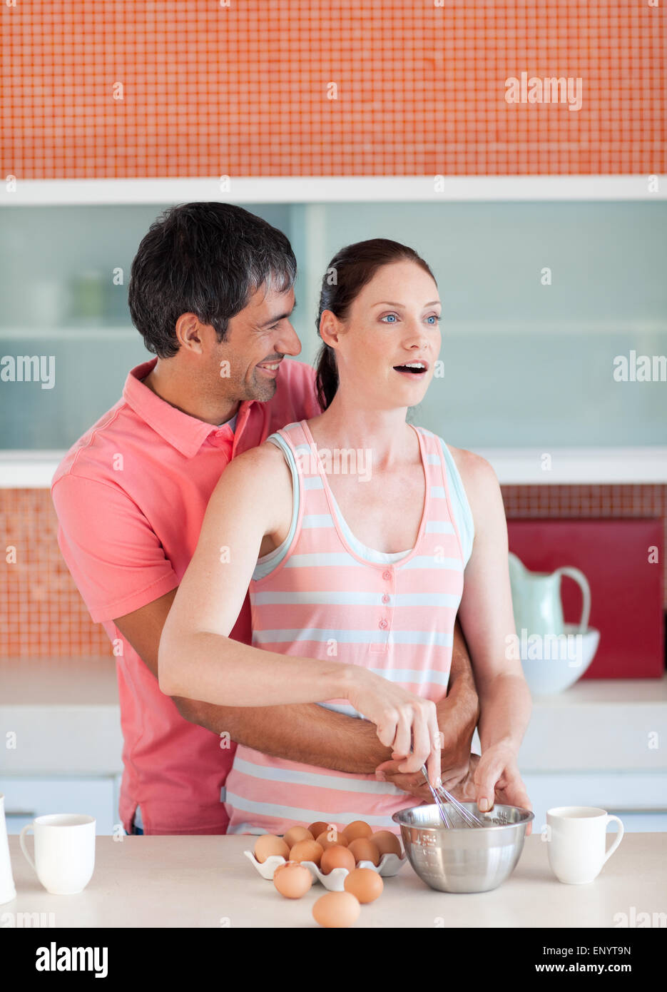 Young couple cooking together Stock Photo - Alamy