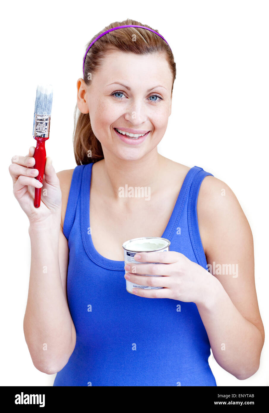 Bright woman using a paintbrush against a white background Stock Photo ...