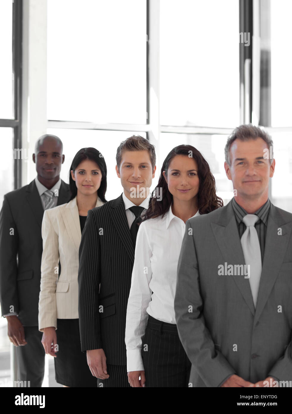 Young positive Business team looking at camera Stock Photo - Alamy