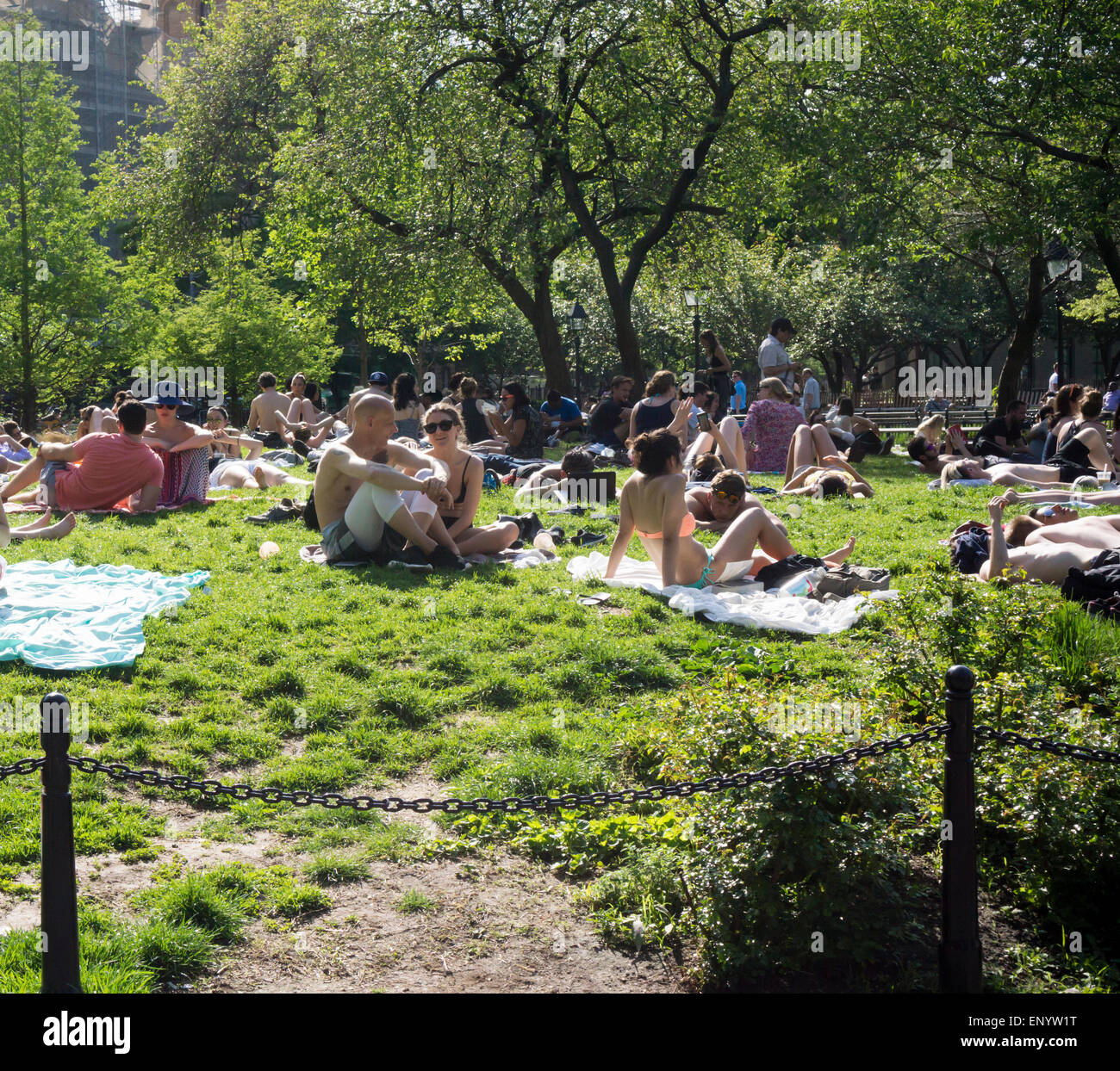 Sunbathers in Washington Square Park in Greenwich Village in New York ...