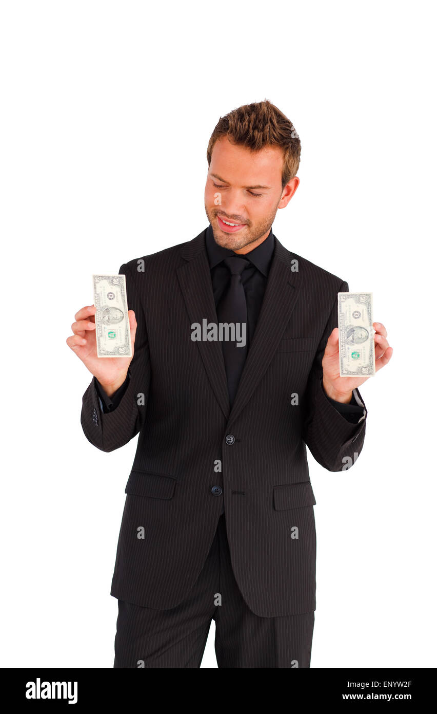 Attractive businessman holding money isolated against white background ...