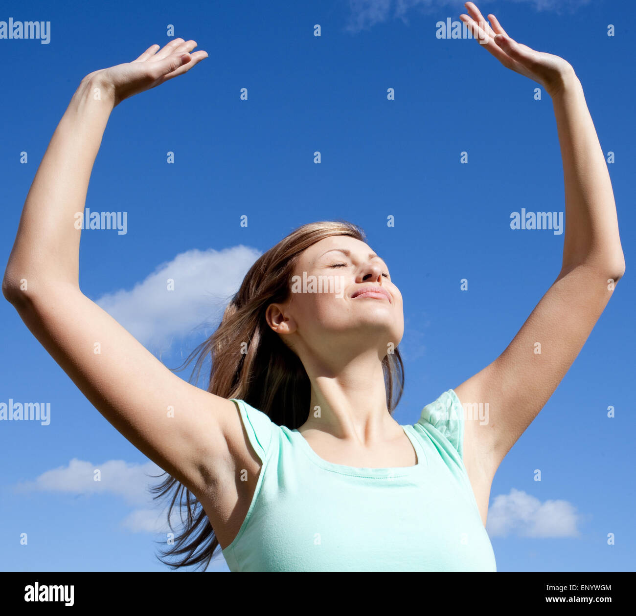 Cute woman punching the air outdoor Stock Photo - Alamy