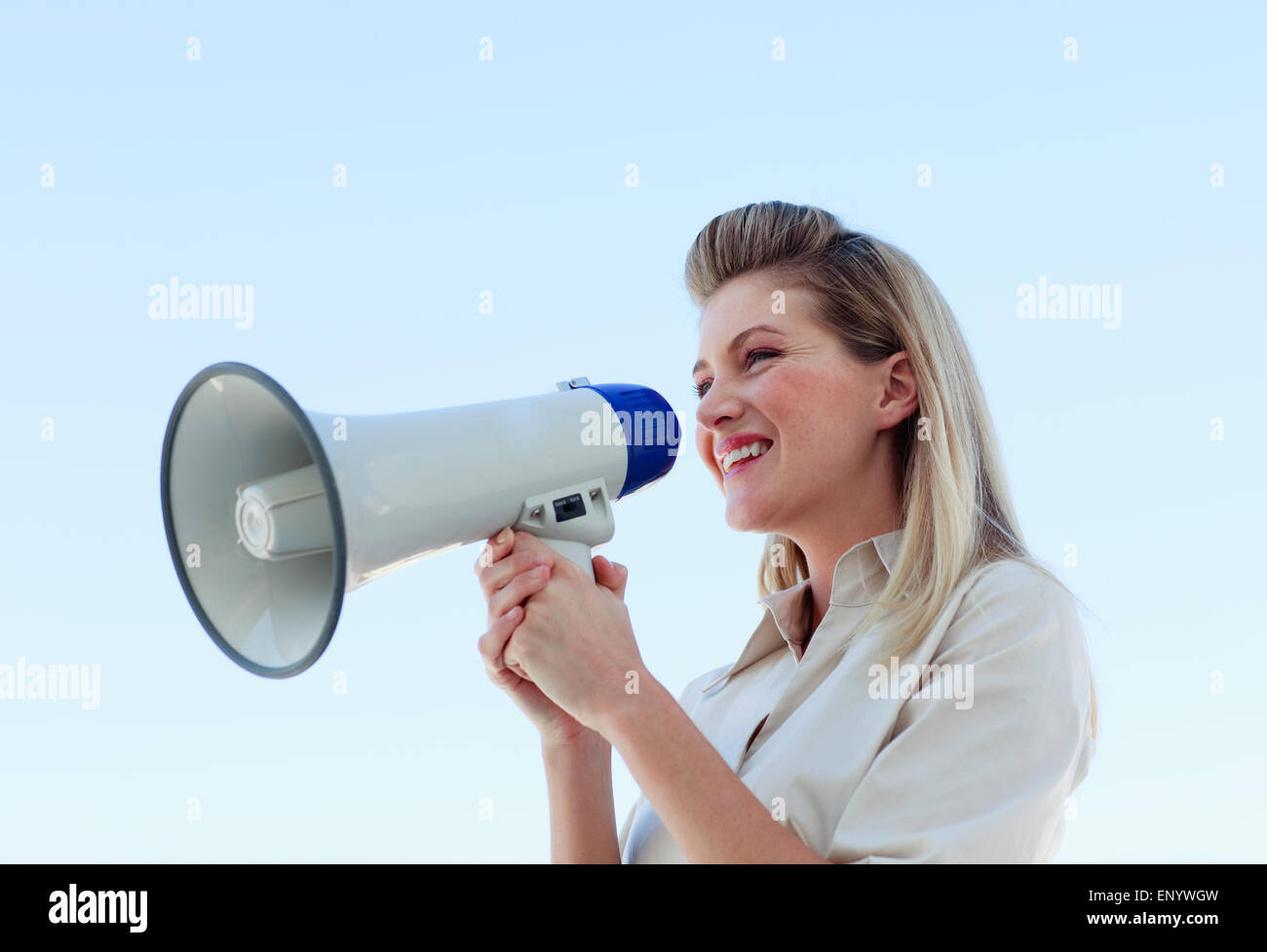 Businesswoman shouting through megaphone Stock Photo - Alamy