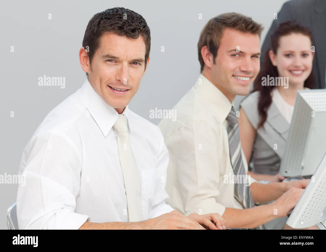 Business people using computers in an office Stock Photo - Alamy