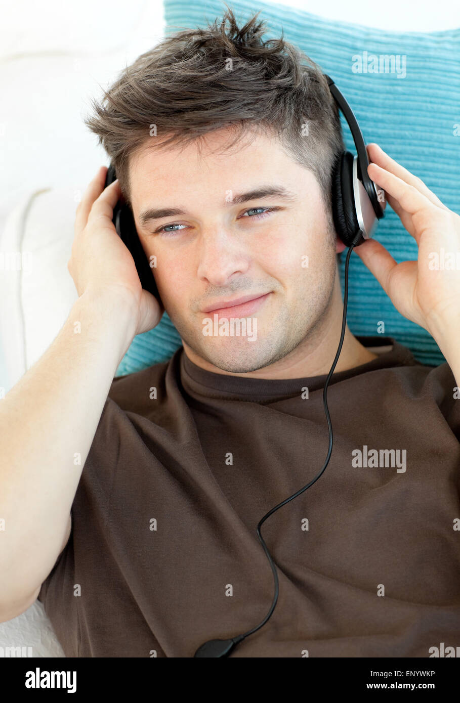 Handsome man with headphones listening to music Stock Photo - Alamy