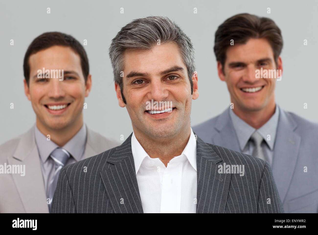 Serious Business co-workers standing in a line Stock Photo - Alamy