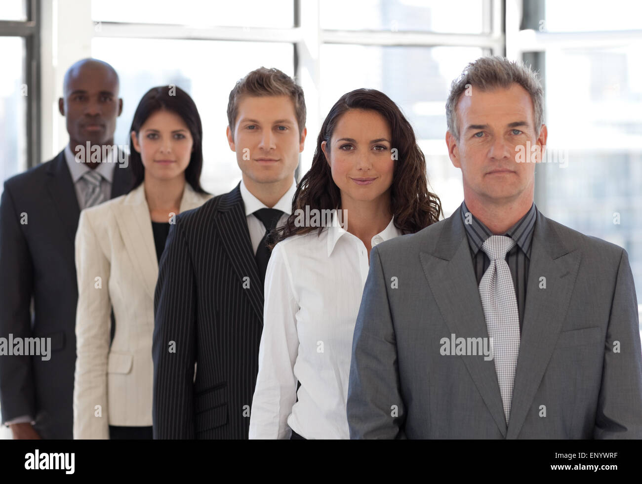 Young positive Business team looking at camera Stock Photo - Alamy