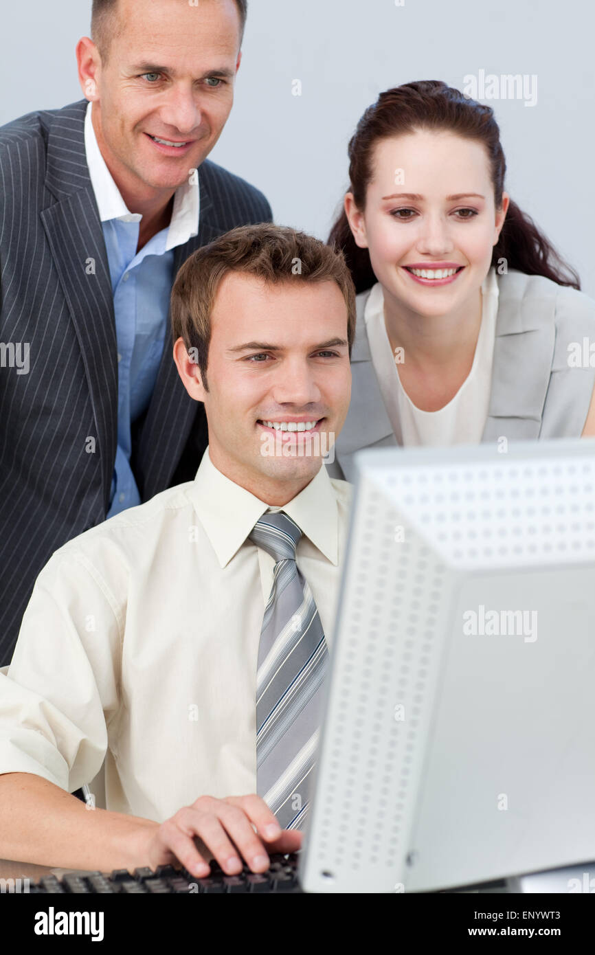 Business team working together with a computer Stock Photo - Alamy