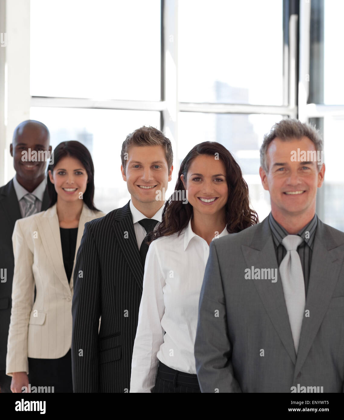 Young Happy Business team looking at camera Stock Photo - Alamy