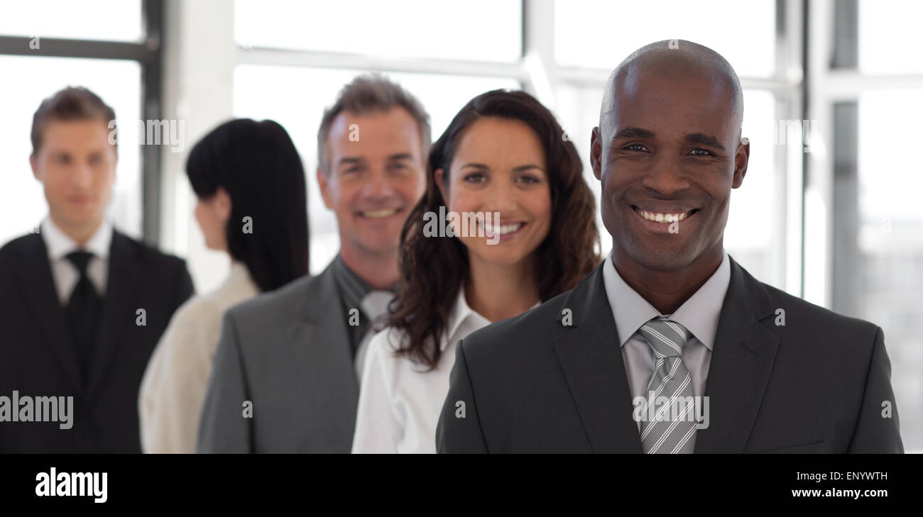 Five person Business team looking at camera and smiling Stock Photo - Alamy