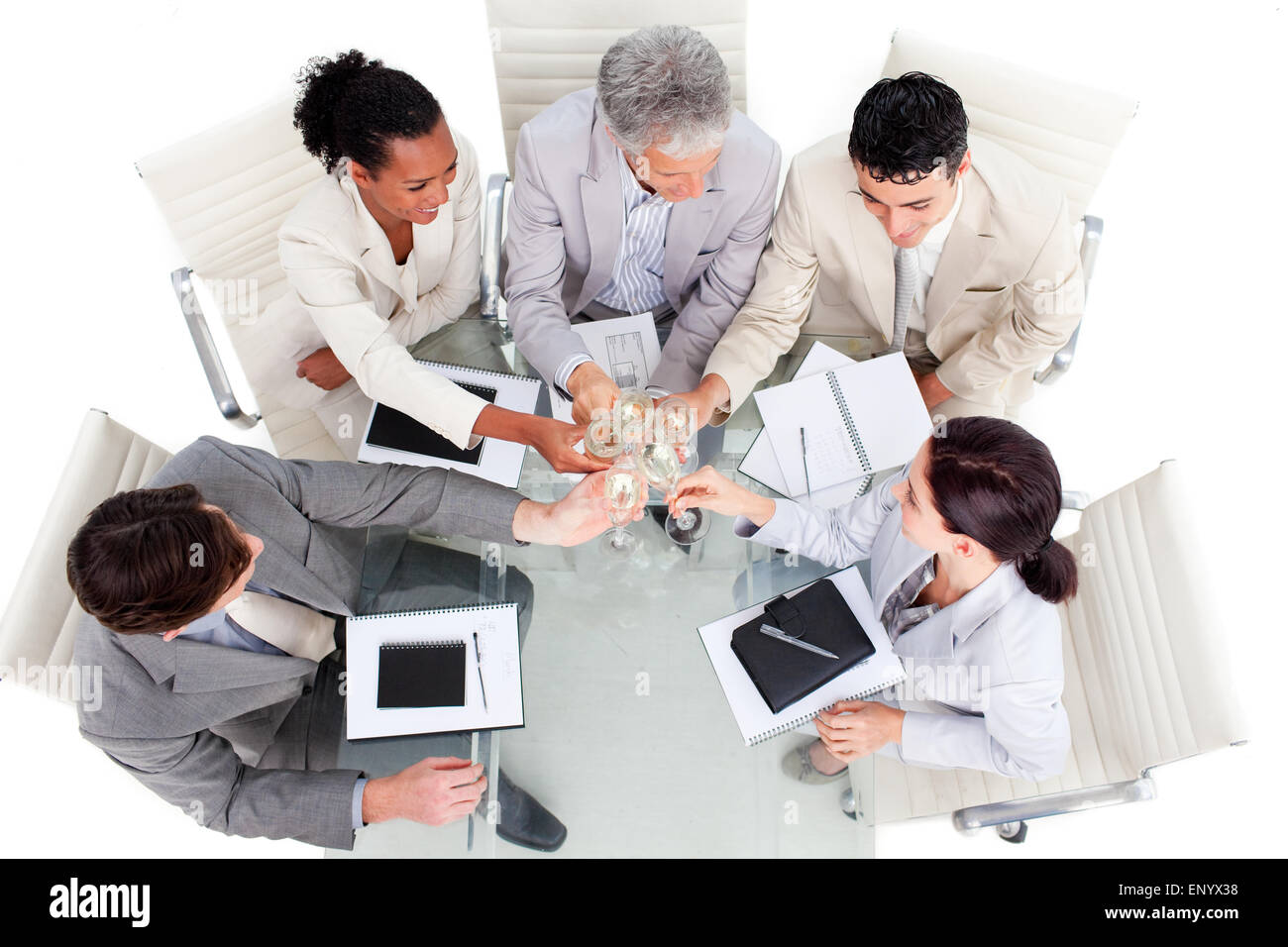 Prosperous business team celebrating a success against a white ...