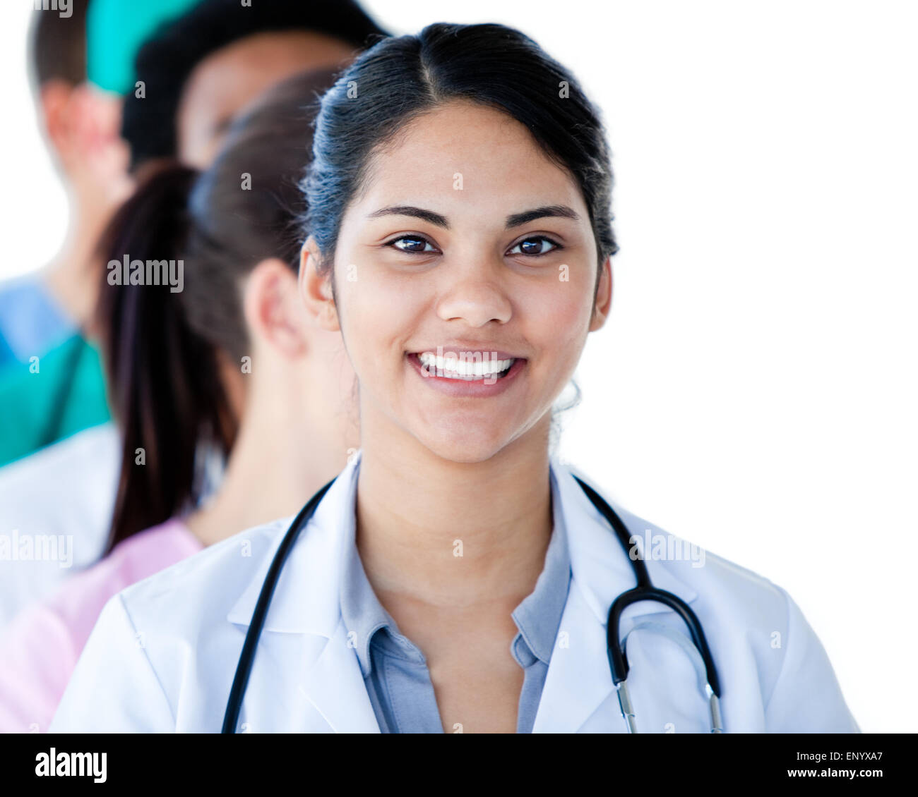 Portrait of a multi-ethnic medical team standing in a line against a ...