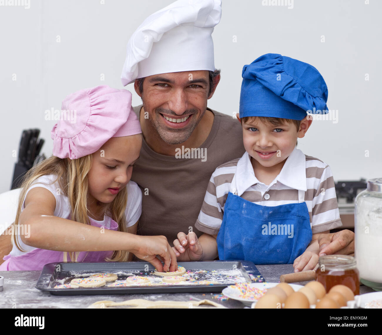 Father and daughter and son baking in the kitchen Stock Photo - Alamy