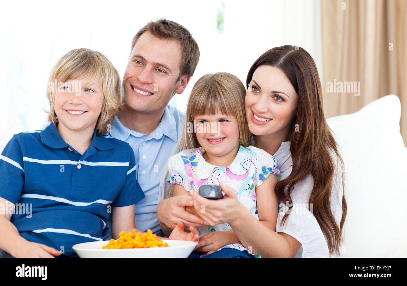 Smiling family watching TV Stock Photo - Alamy