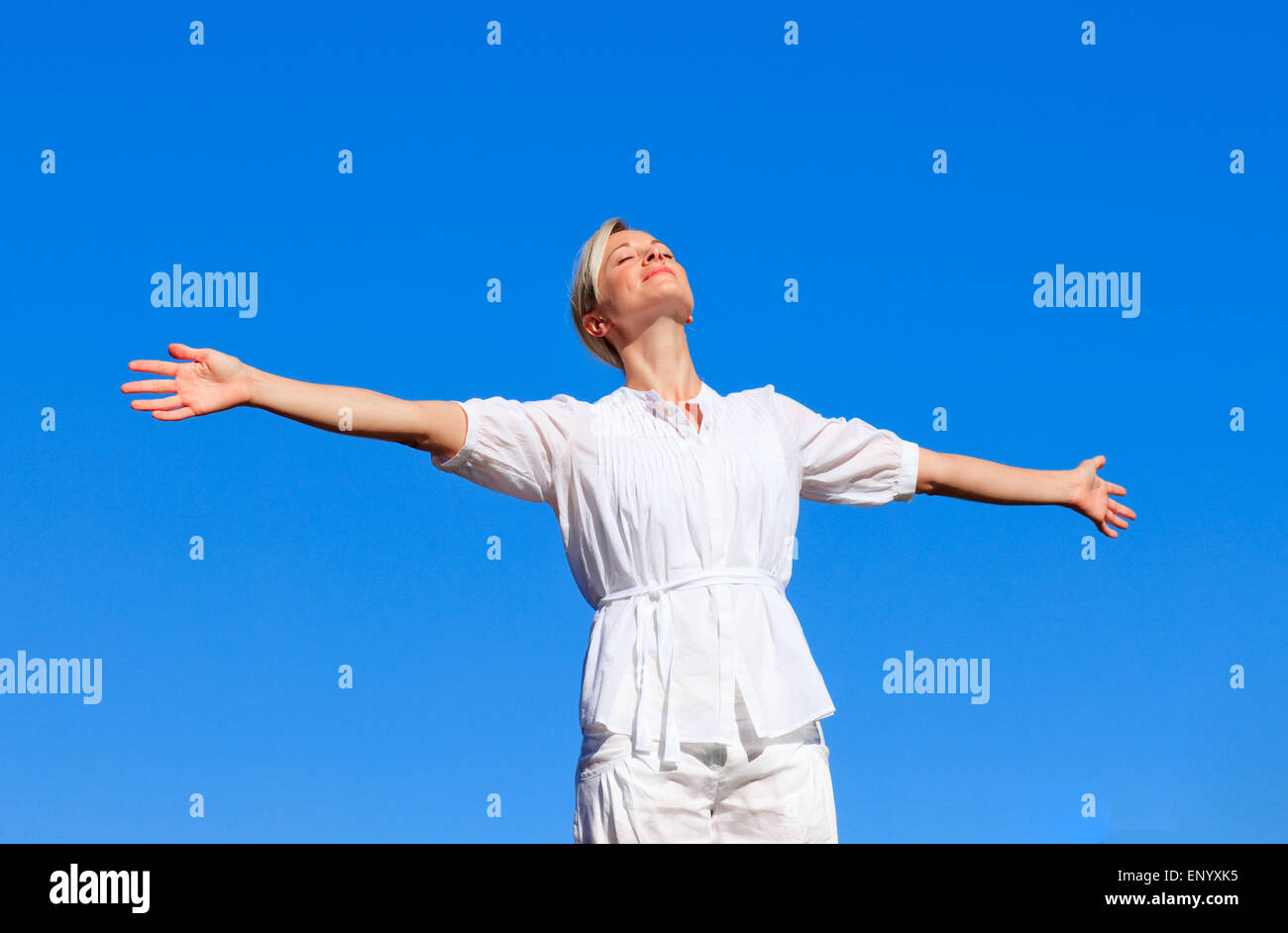Happy woman with open arms Stock Photo - Alamy