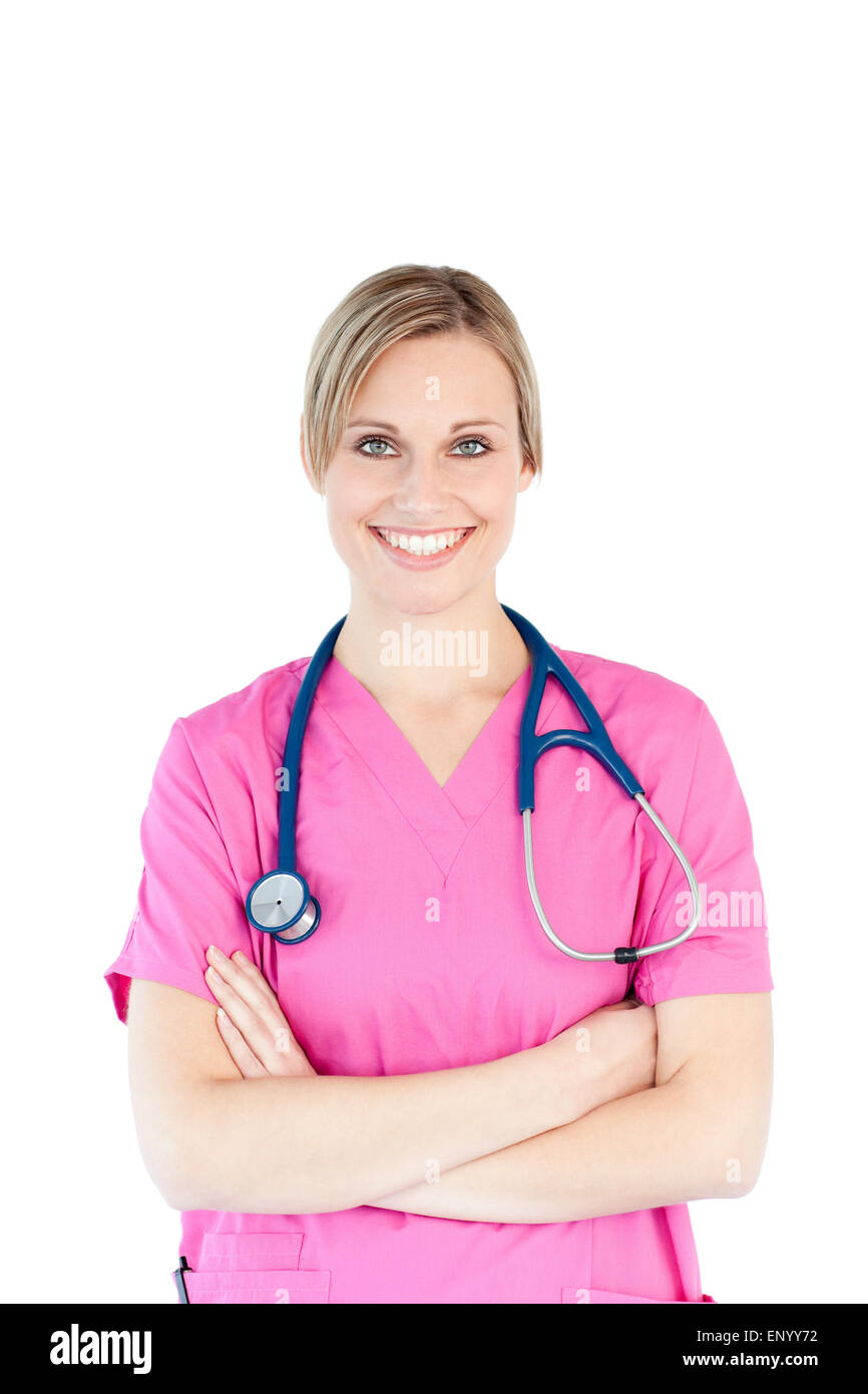 Delighted nurse in a pink workwear against white background Stock Photo ...
