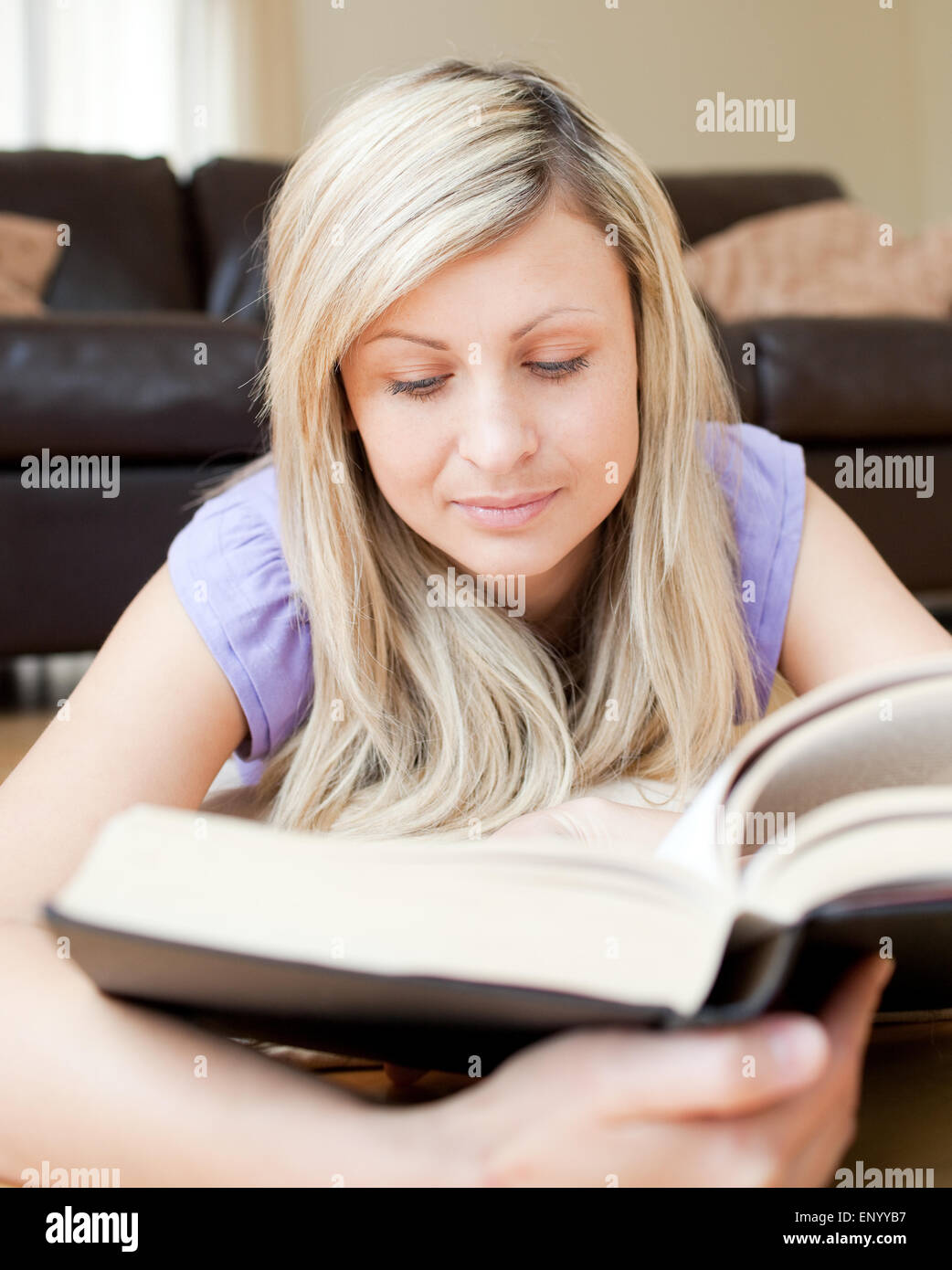 Cute woman reading a book Stock Photo - Alamy